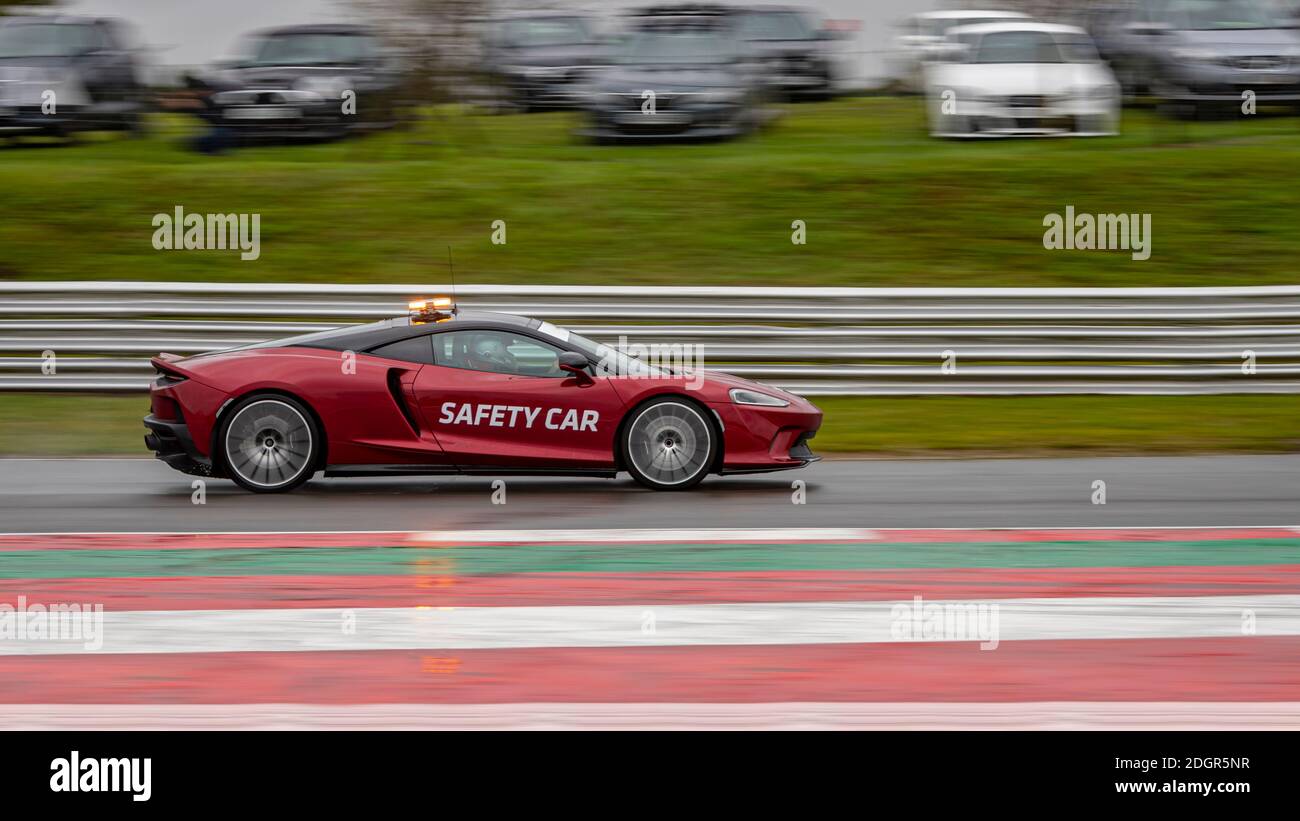A panning shot of a racing car as it circuits a track Stock Photo - Alamy