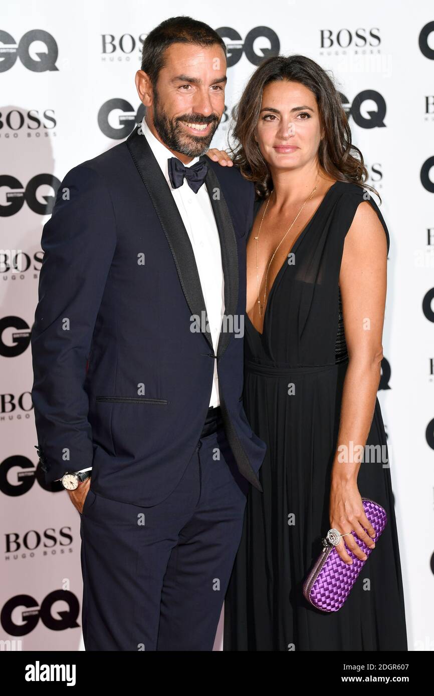 Robert Pires and Jessica Lemarie attending the GQ Men of the Year ...