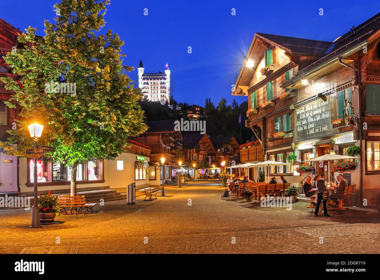 Night scene along the charming promenade of Gstaad, a popular mountain ...