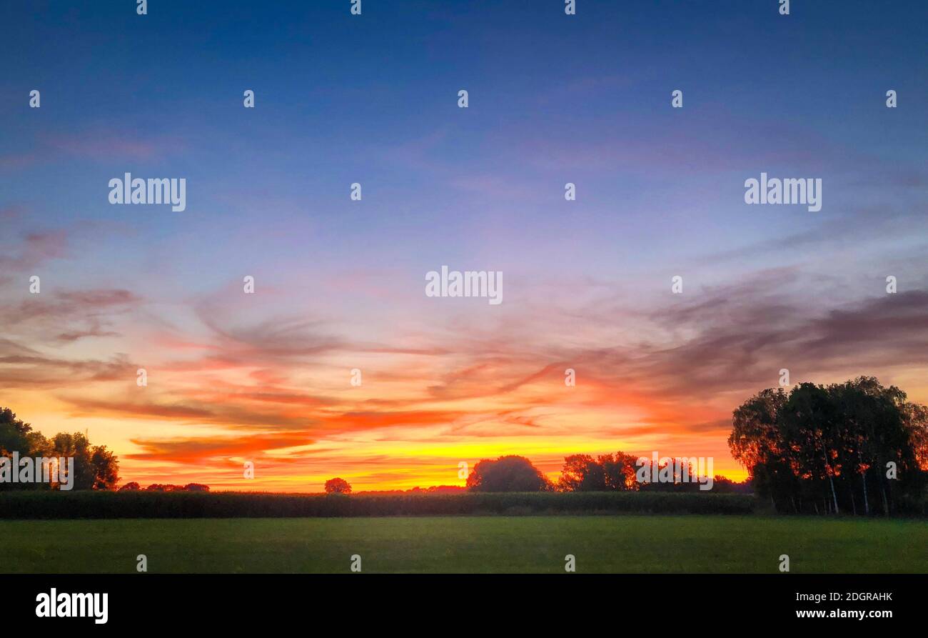 Colorful glowing sunrise Stock Photo - Alamy