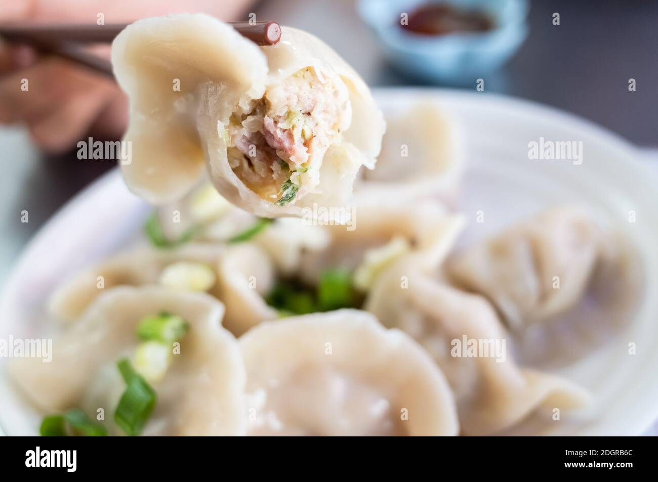Eat boiled jiaozi Stock Photo - Alamy
