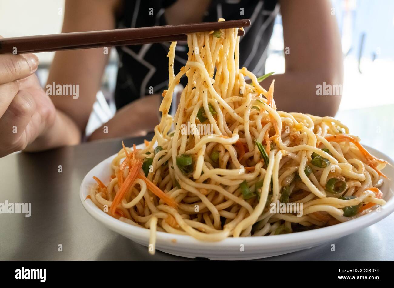 Eating cold noodles Stock Photo - Alamy