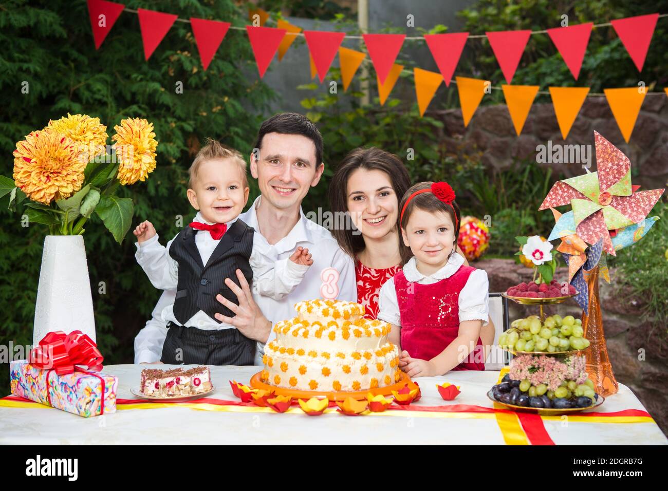 Family of four people father mom son and daughter celebrates daughter's ...