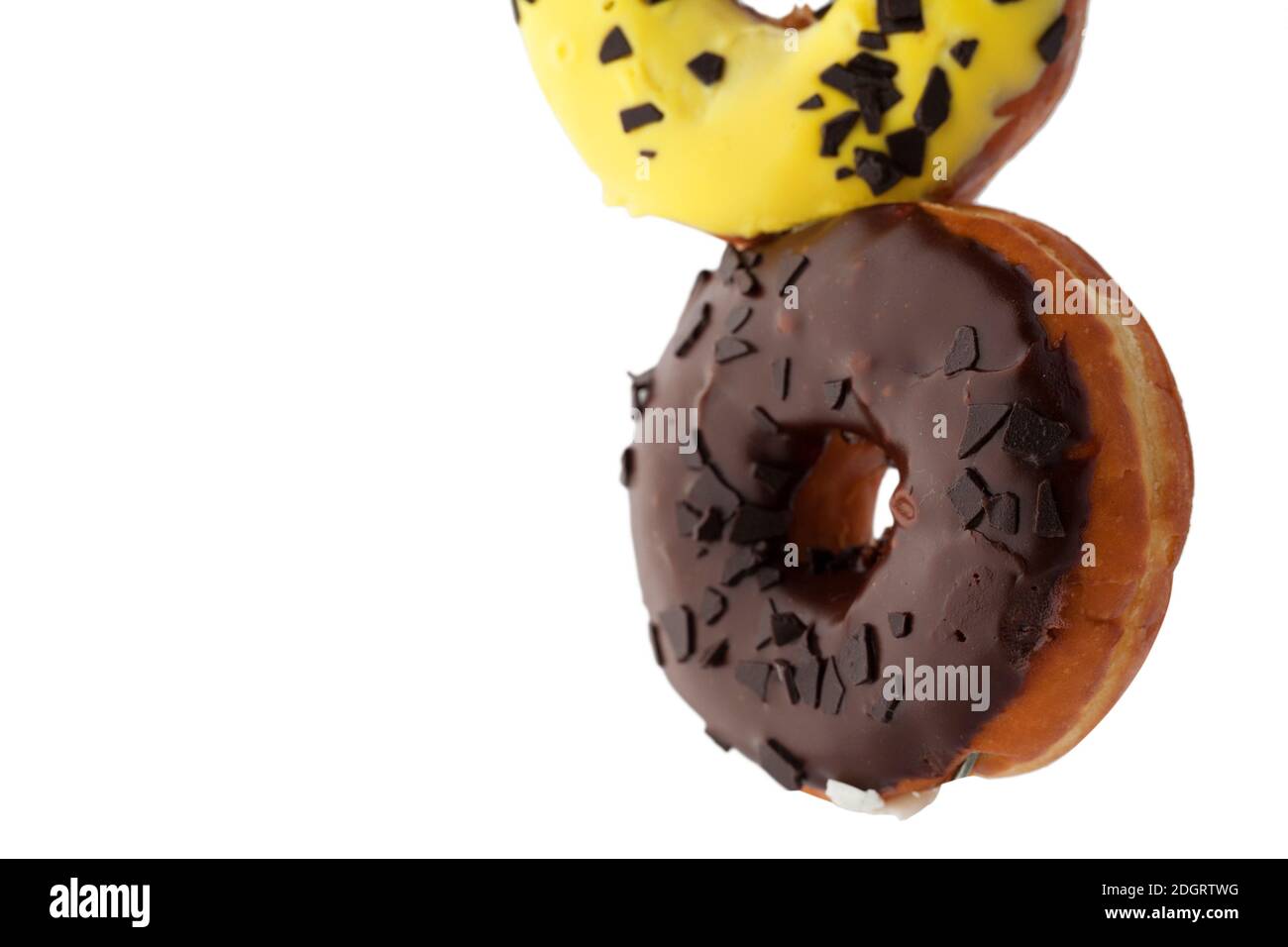 Appetizing levitating chocolate topping donuts isolated on white ...