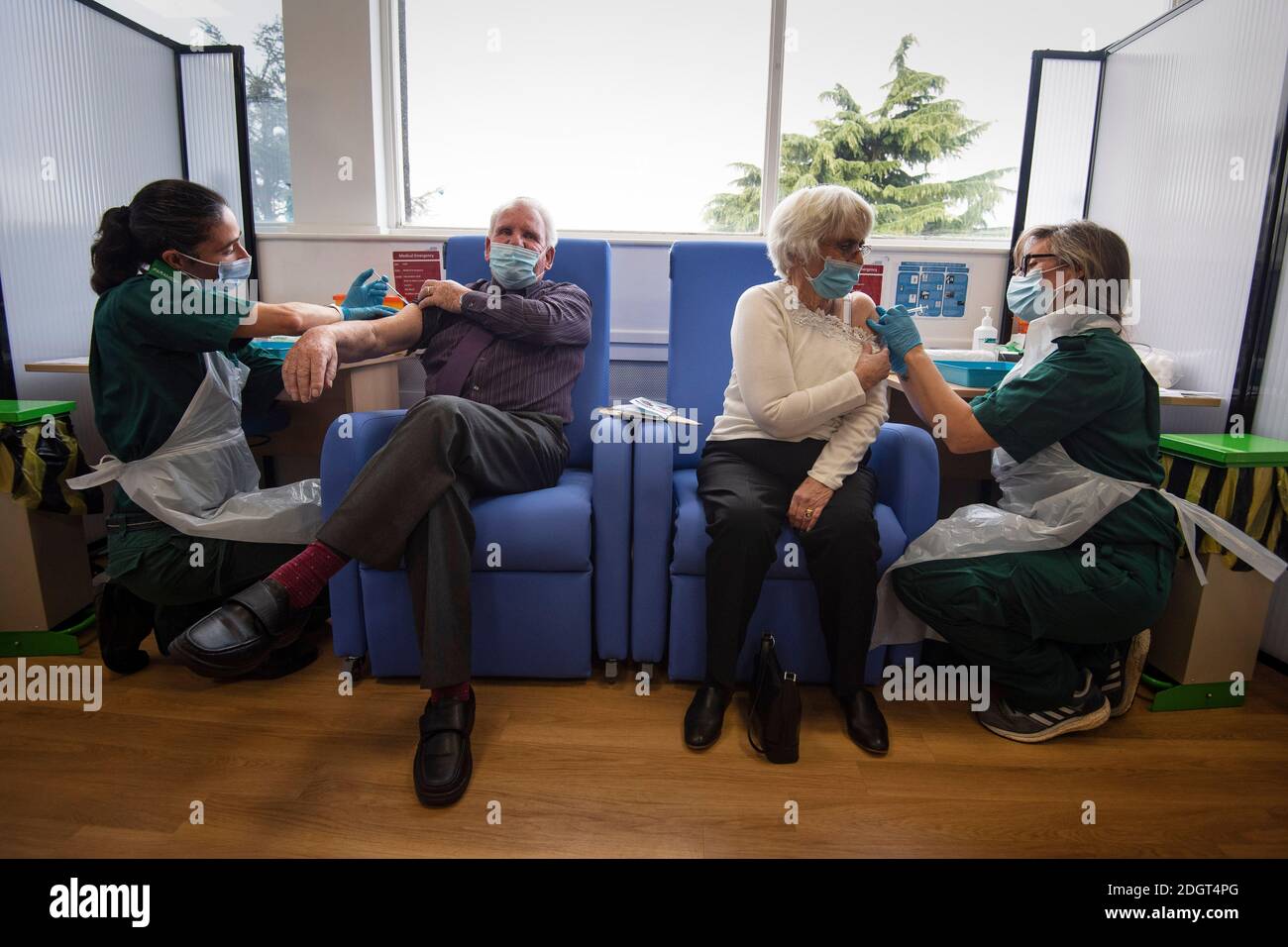 Husband and wife Vic and Penny Griffiths receive the Pfizer/BioNTech ...