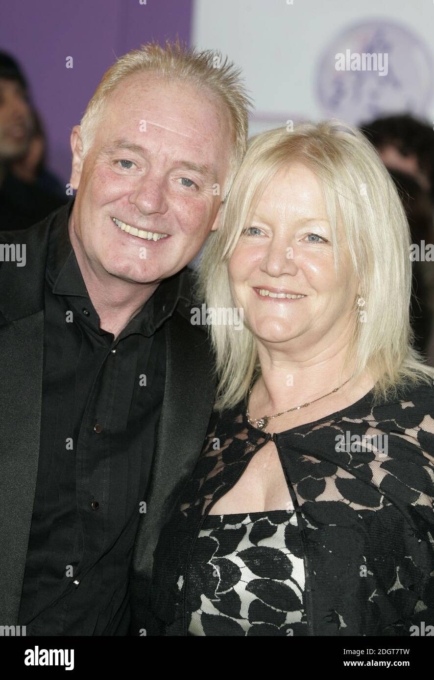 Bruce Jones and wife arriving Stock Photo - Alamy