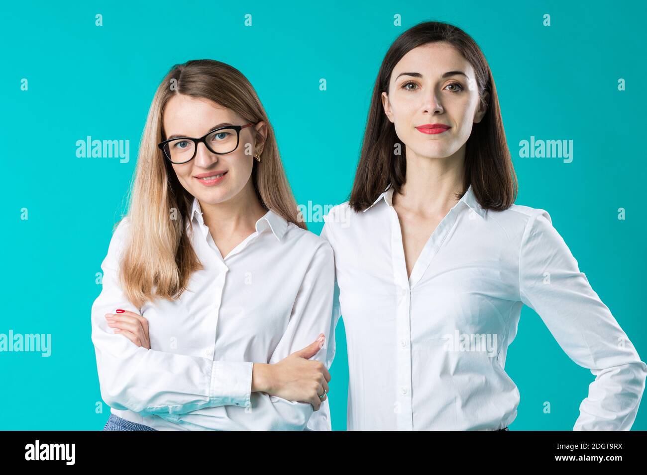 Portrait of two women in office clothes. Cute attractive businesswomen ...