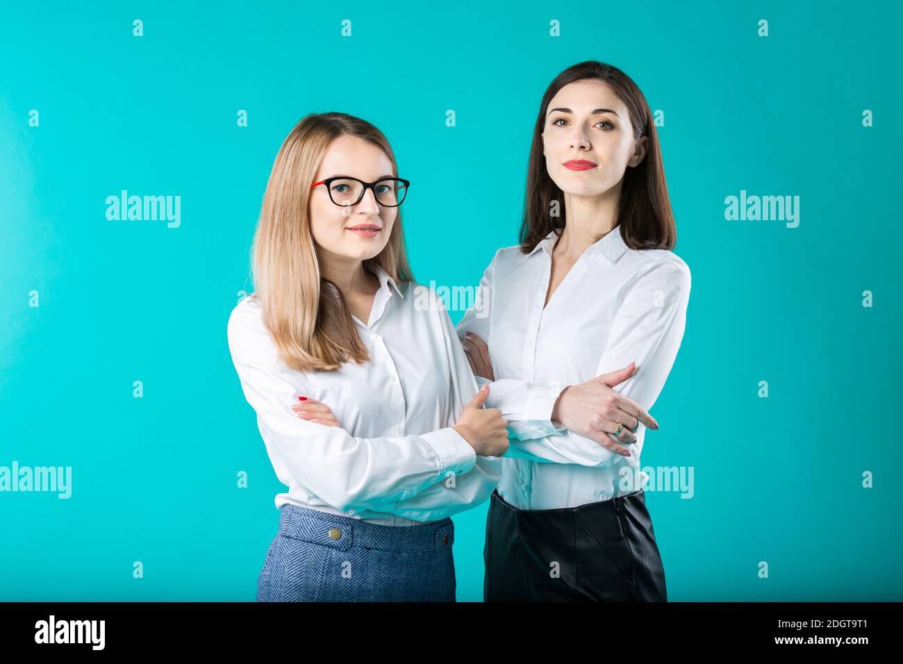 The theme is a female team. Portrait of two young caucasian business ...