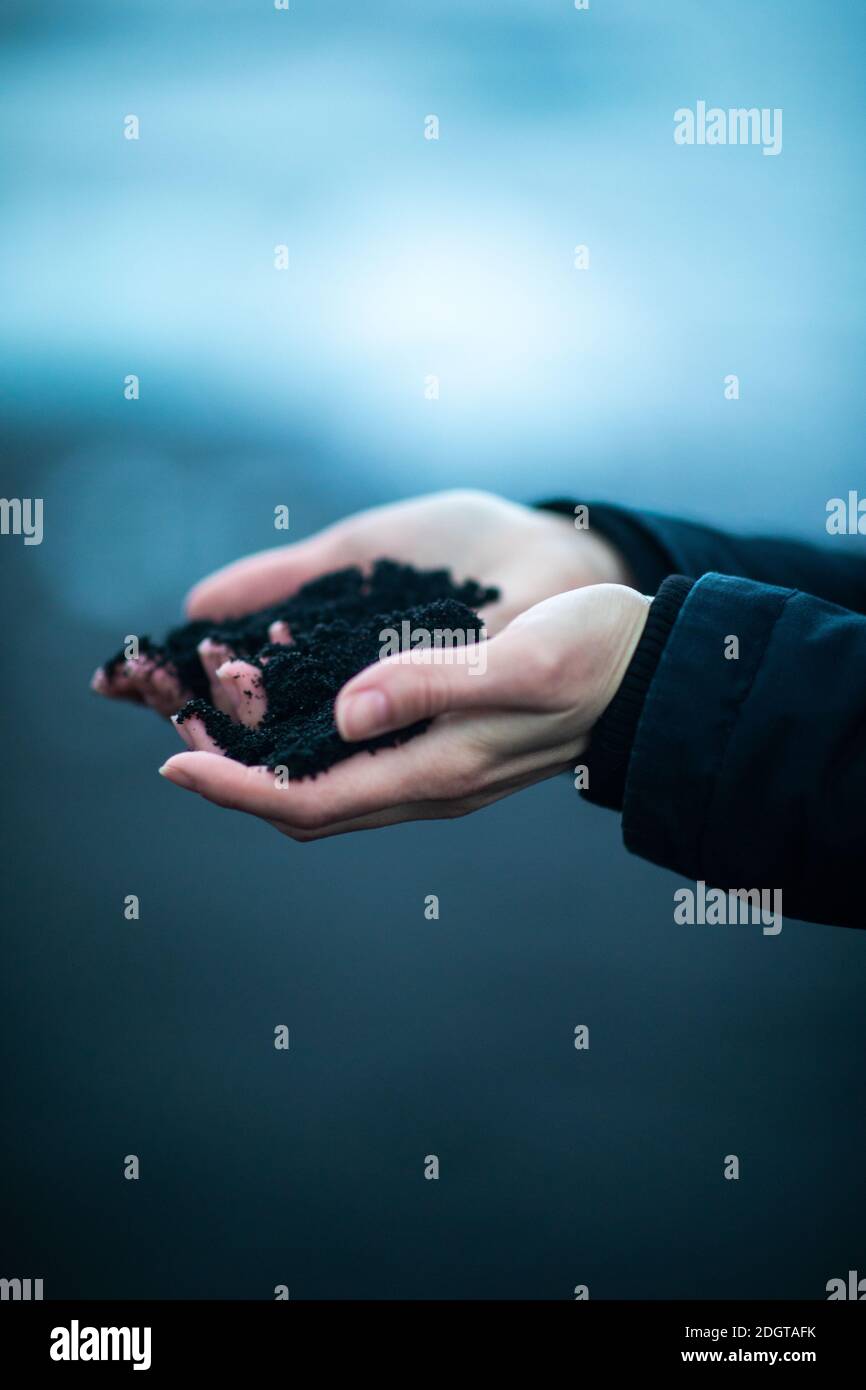 Volcanic sand in hand hi-res stock photography and images - Alamy