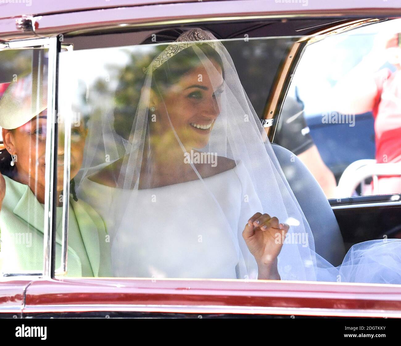 Meghan Markle rides in a car accompanied by her mother, Ms Doria ...