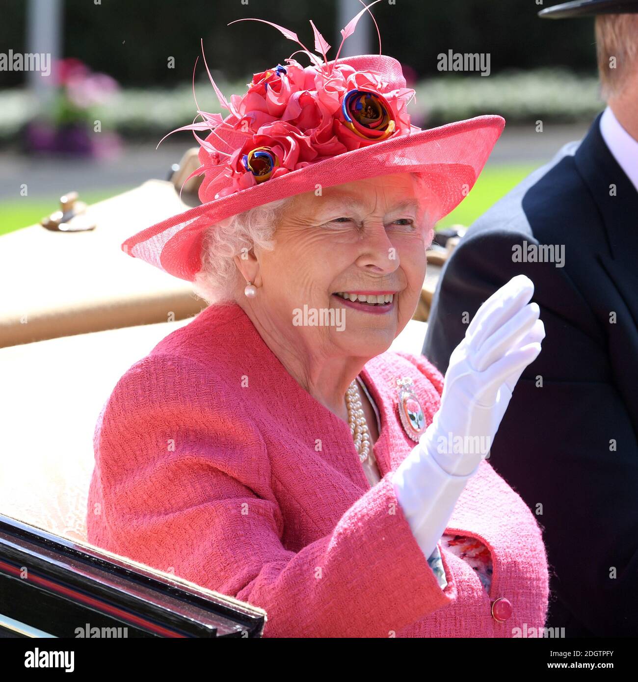 Queen Elizabeth II waves to the crowd during day three of Royal Ascot ...