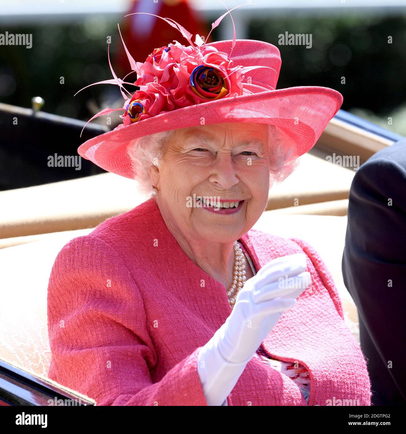 Queen Elizabeth II waves to the crowd during day three of Royal Ascot ...