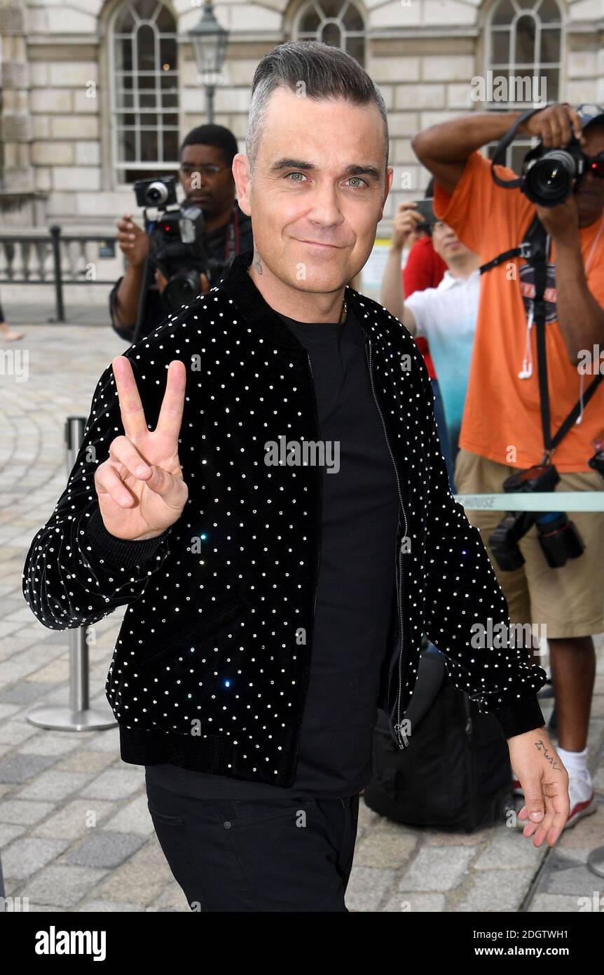 Robbie Williams arrives at the X Factor photocall held at Somerset ...
