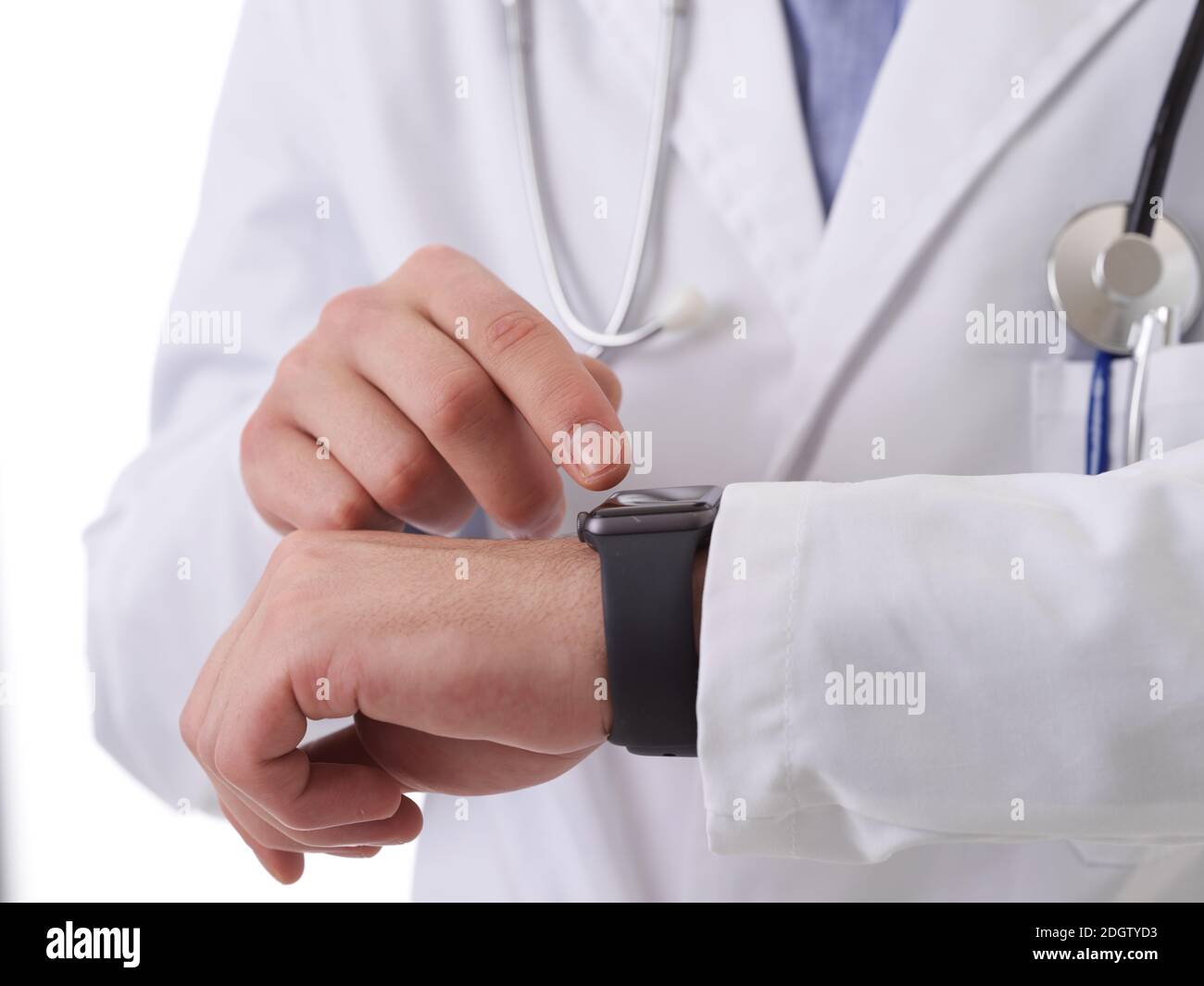 Doctor using smartwatch while checking heartbeat pulse Stock Photo - Alamy
