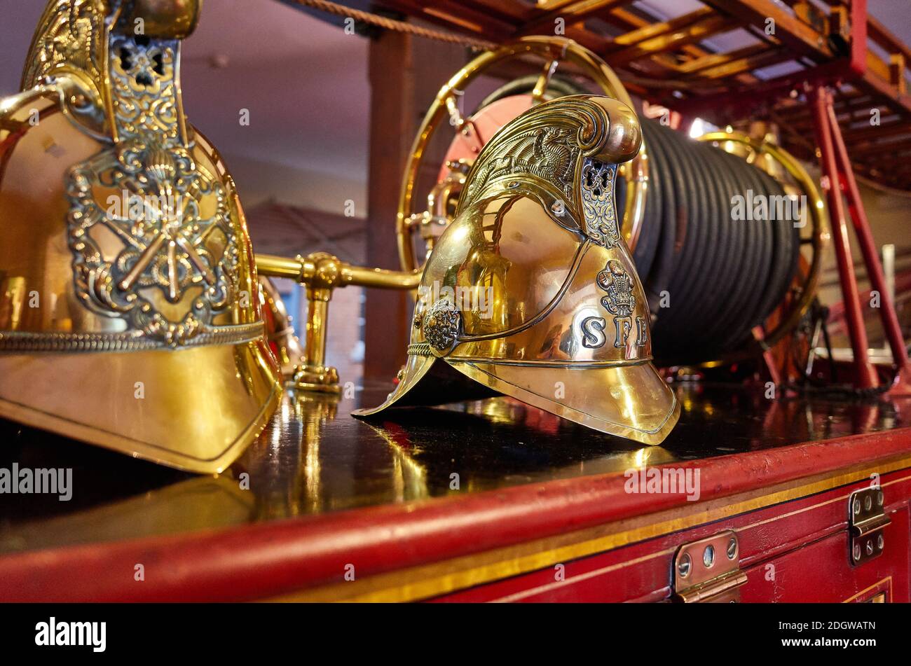 Brass fireman helmets on a vintage fire engine - displayed at the ...