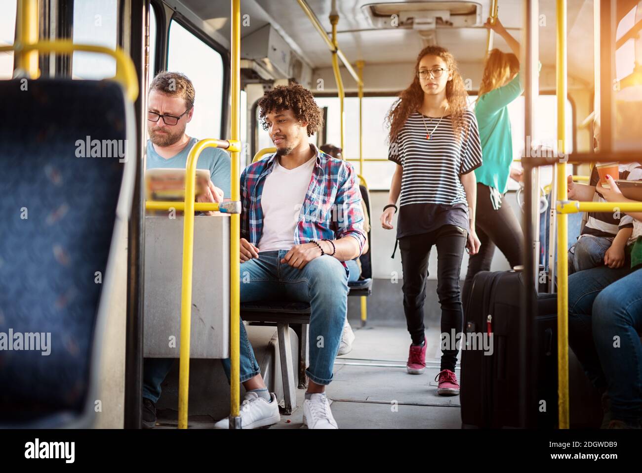 People bus riding standing hi-res stock photography and images - Alamy