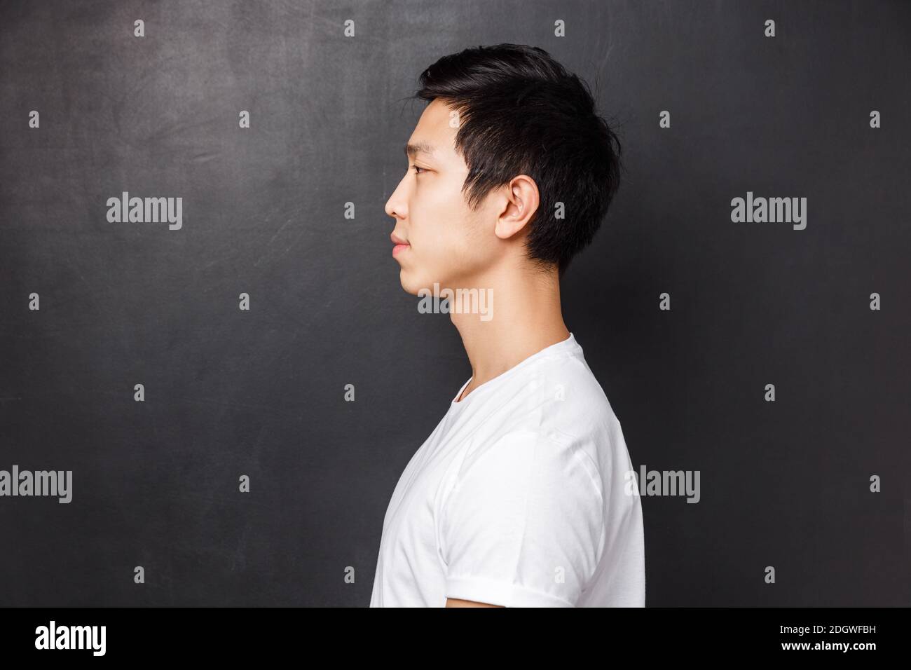 Profile portrait of young asian male model in white t-shirt smiling ...