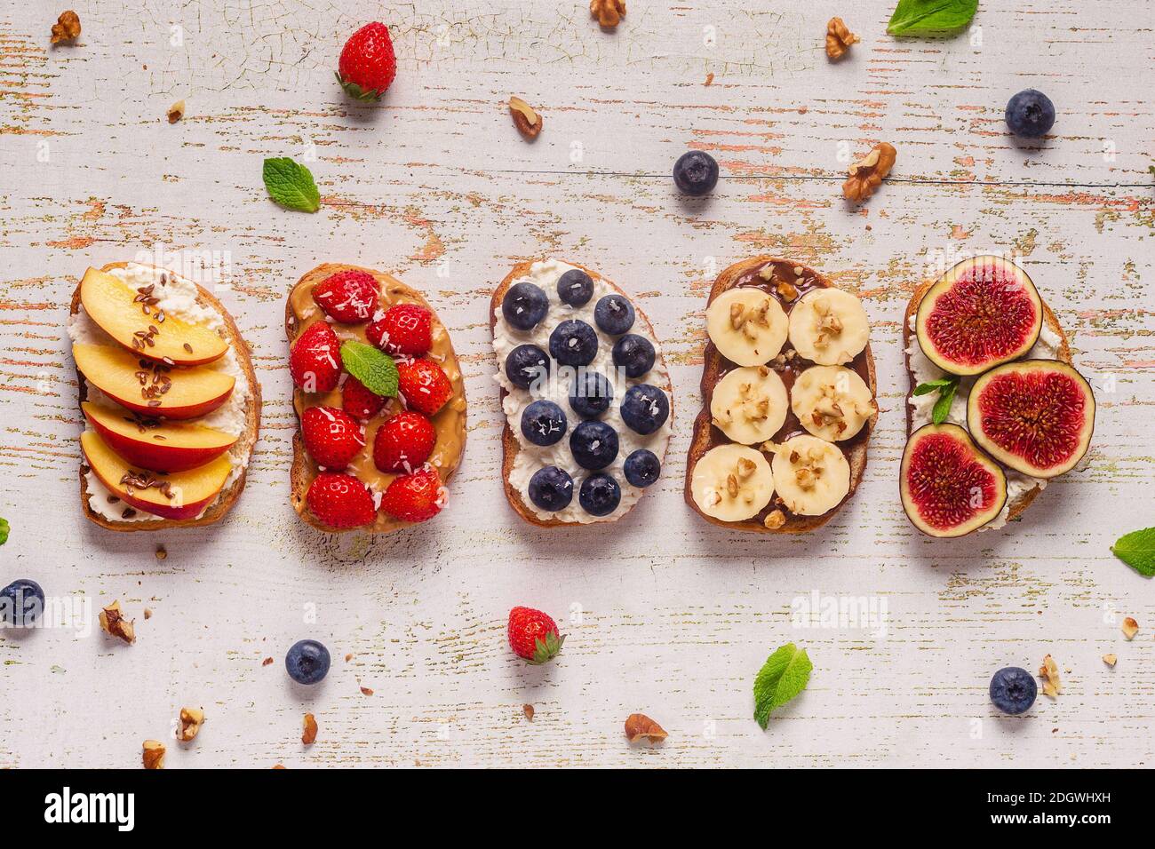 Homemade summer toast with cream cheese, nut butter and fruits and ...