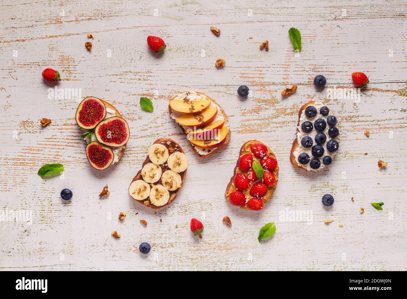 Homemade summer toast with cream cheese, nut butter and fruits and ...