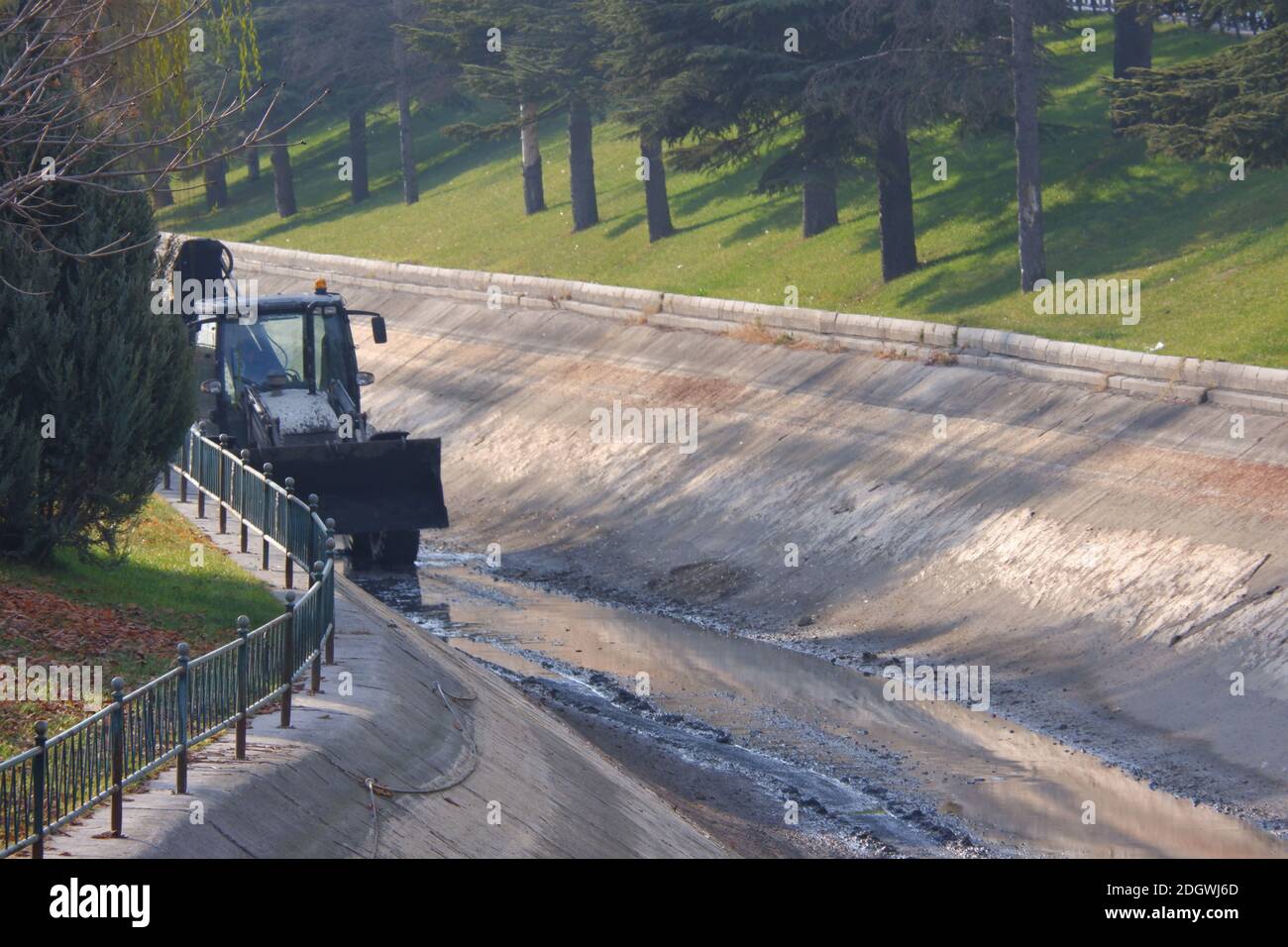 Bulldozer working at water canal Stock Photo - Alamy