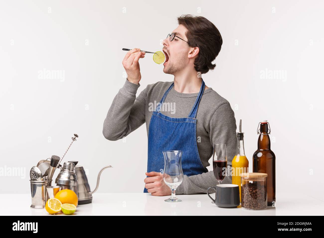 Barista, cafe worker and bartender concept. Funny carefree young man in ...