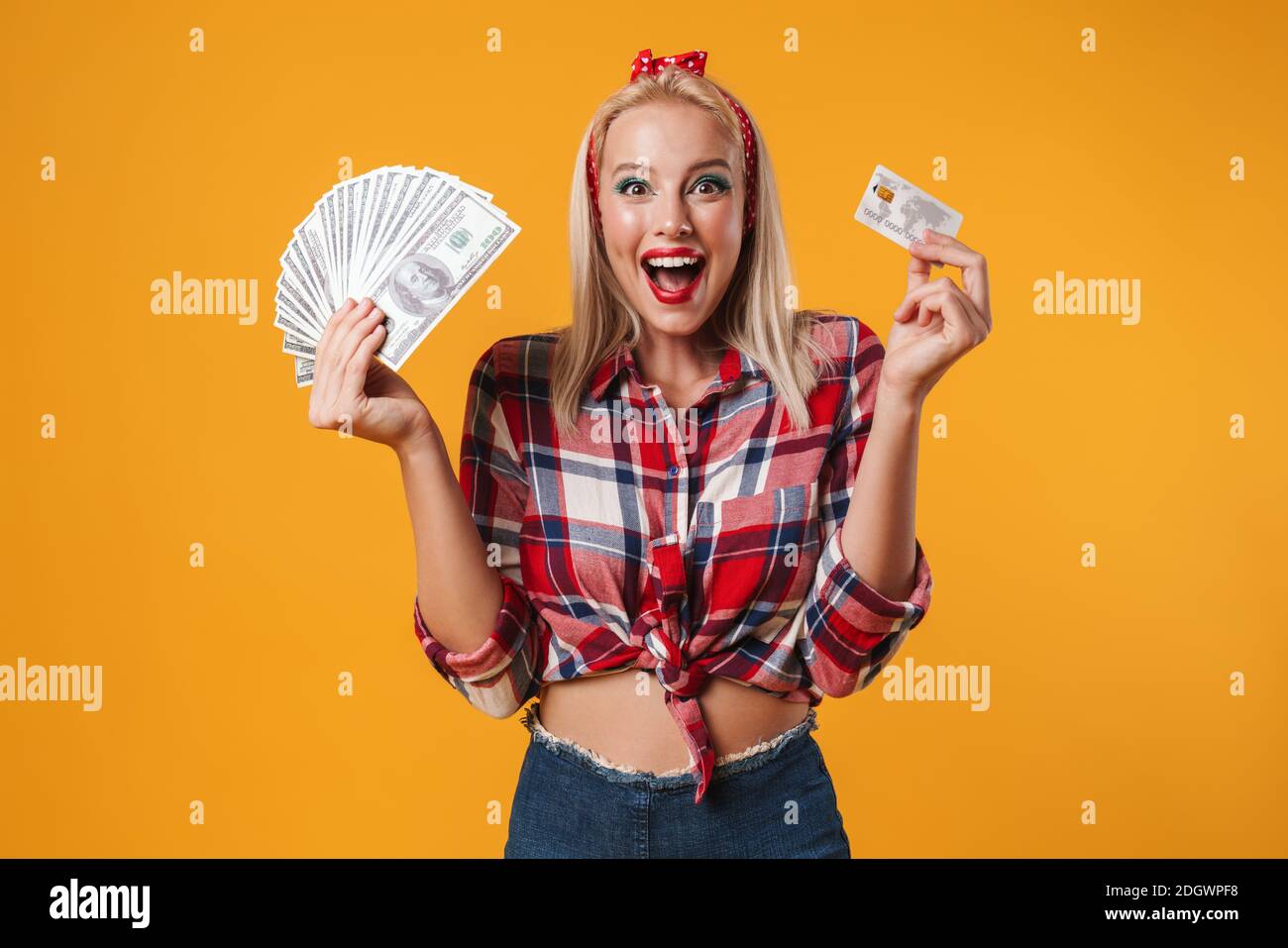 Image of excited blonde pinup girl posing with dollars and credit card ...