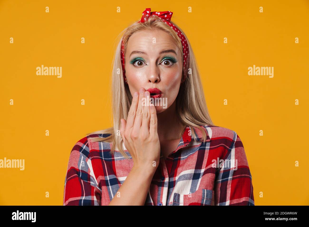 Image of surprised blonde pinup girl posing and looking at camera ...