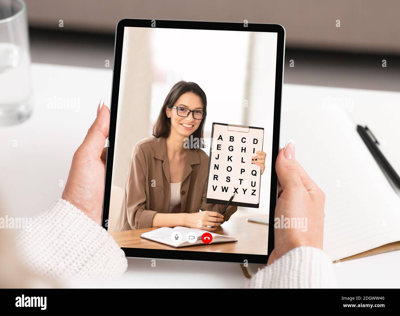 Female Teacher Teaching Online From Tablet Computer Screen Indoors ...