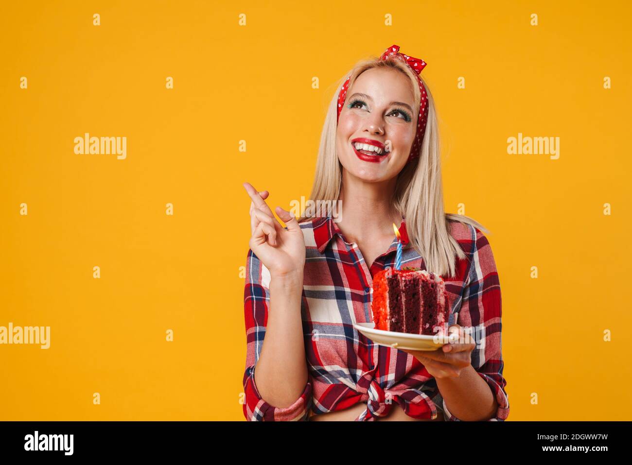 Image of happy pinup girl posing with birthday cake and holding fingers ...