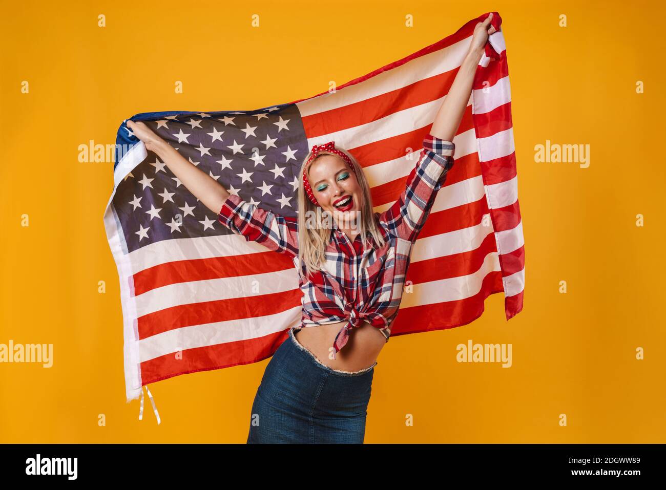 Image of happy charming pinup girl posing with american flag and ...