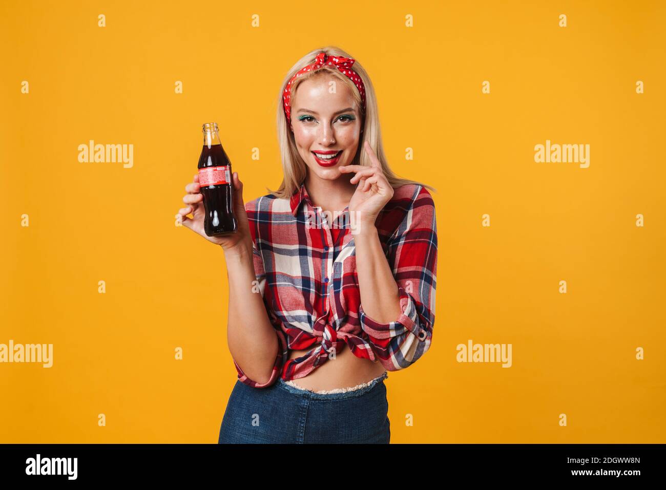 Image of happy charming pinup girl posing with soda and smiling ...