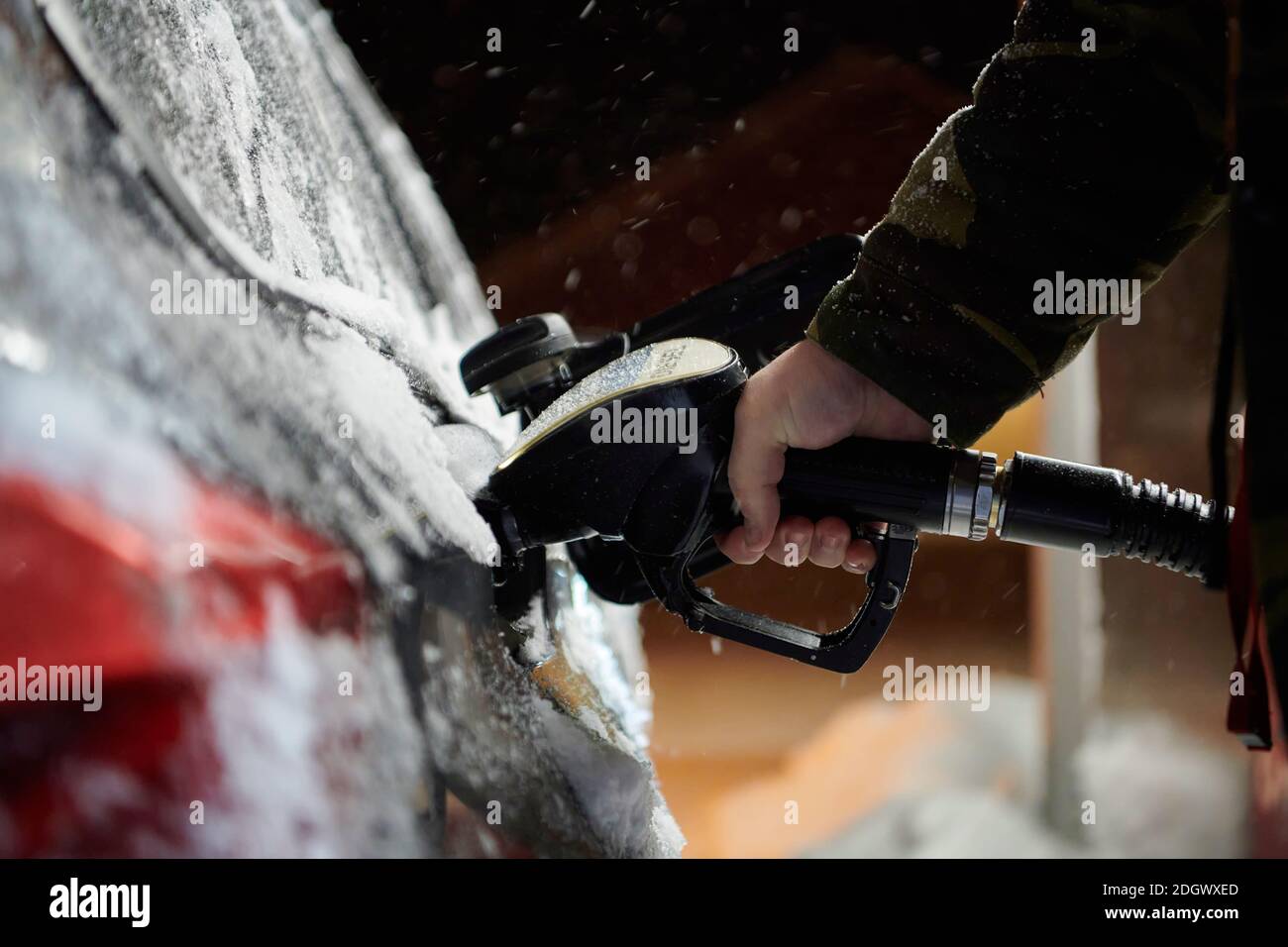 refuelling diesel gas on petrol station at winter Stock Photo - Alamy