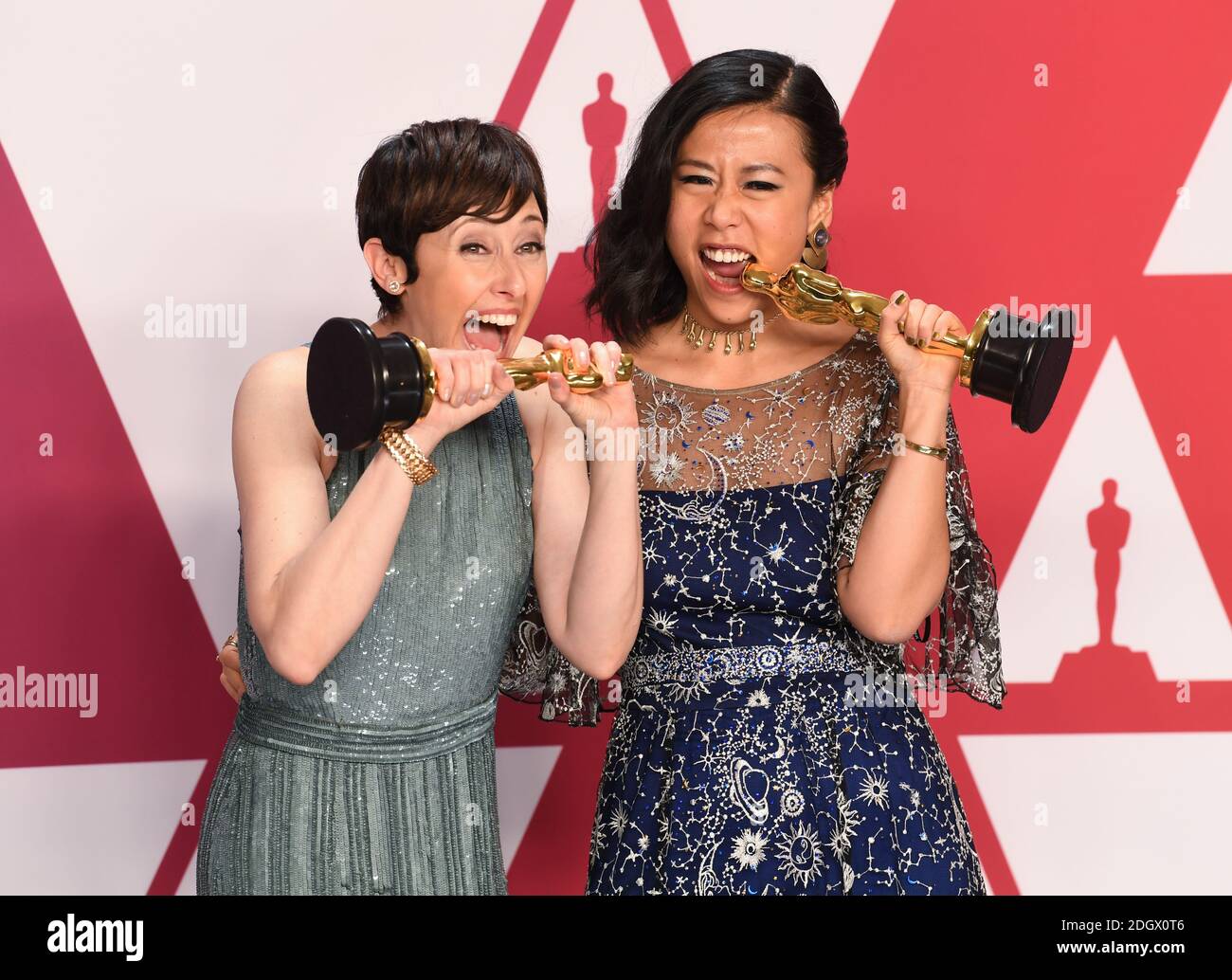 Becky Neiman-Cobb (left) and Domee She with the award for best short ...