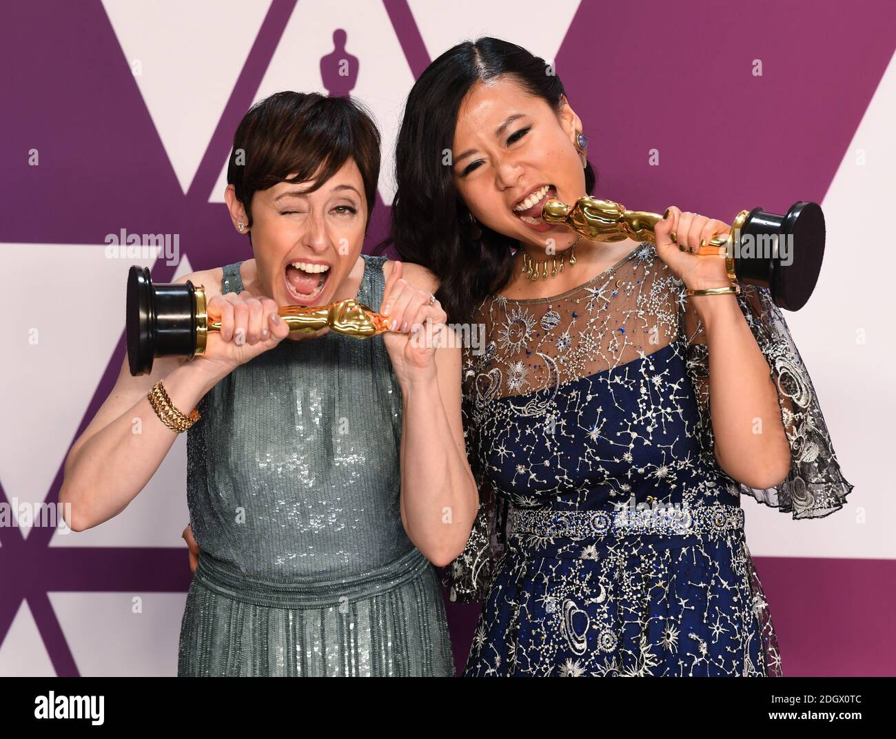 Becky Neiman-Cobb (left) and Domee She with the award for best short ...