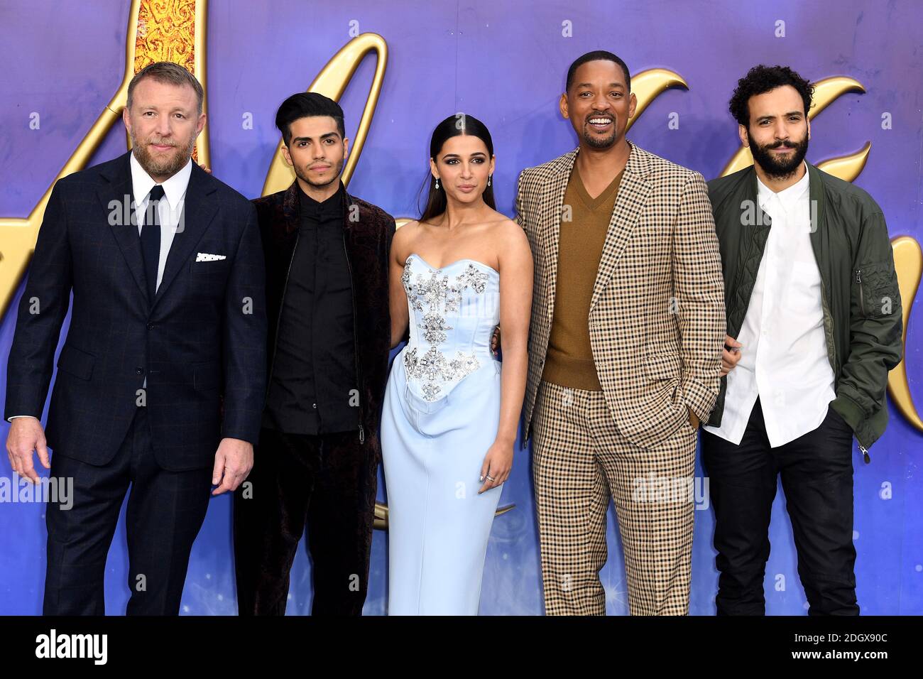 Director and cast (left-right) Guy Ritchie, Mena Massoud, Naomi Scott ...