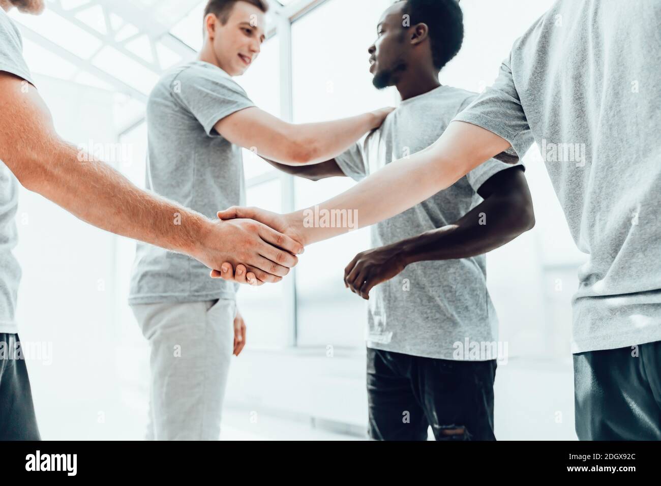 close up. business handshake of two young people Stock Photo - Alamy