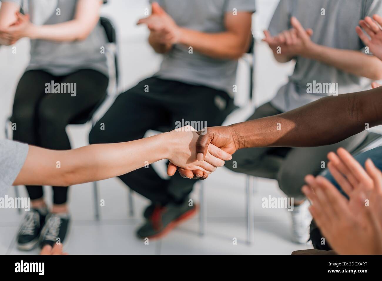 close up. strong handshake of partners during the international Stock ...