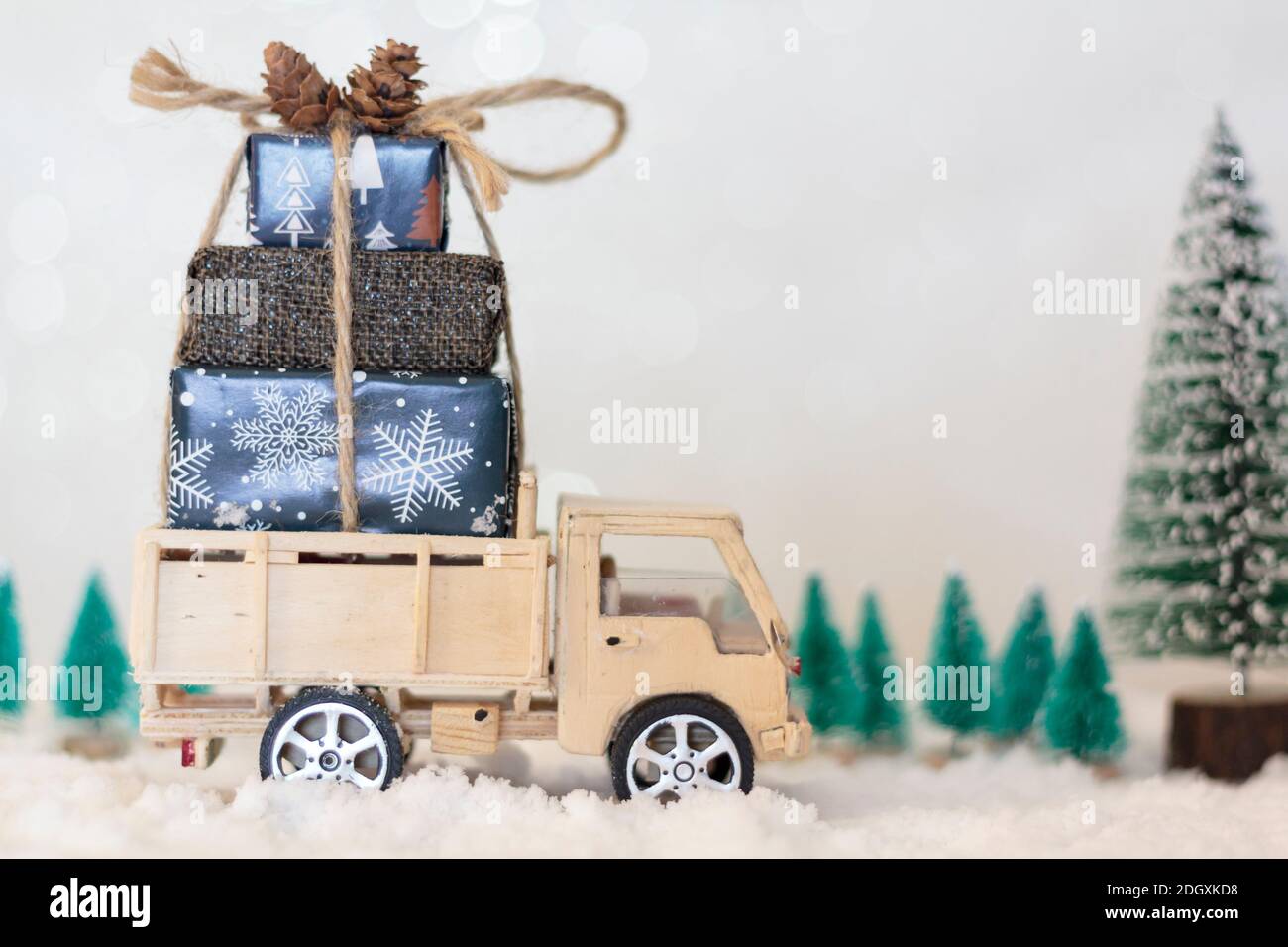 Christmas truck with christmas gifts on snowy road with christmas trees ...
