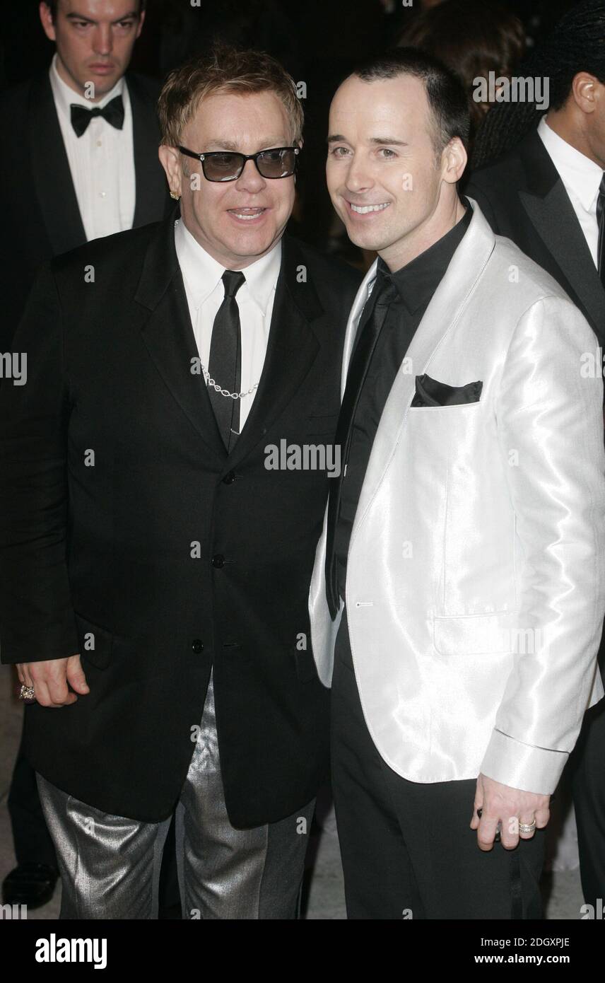 Elton John and David Furnish attending the Vanity Fair Party Oscar ...