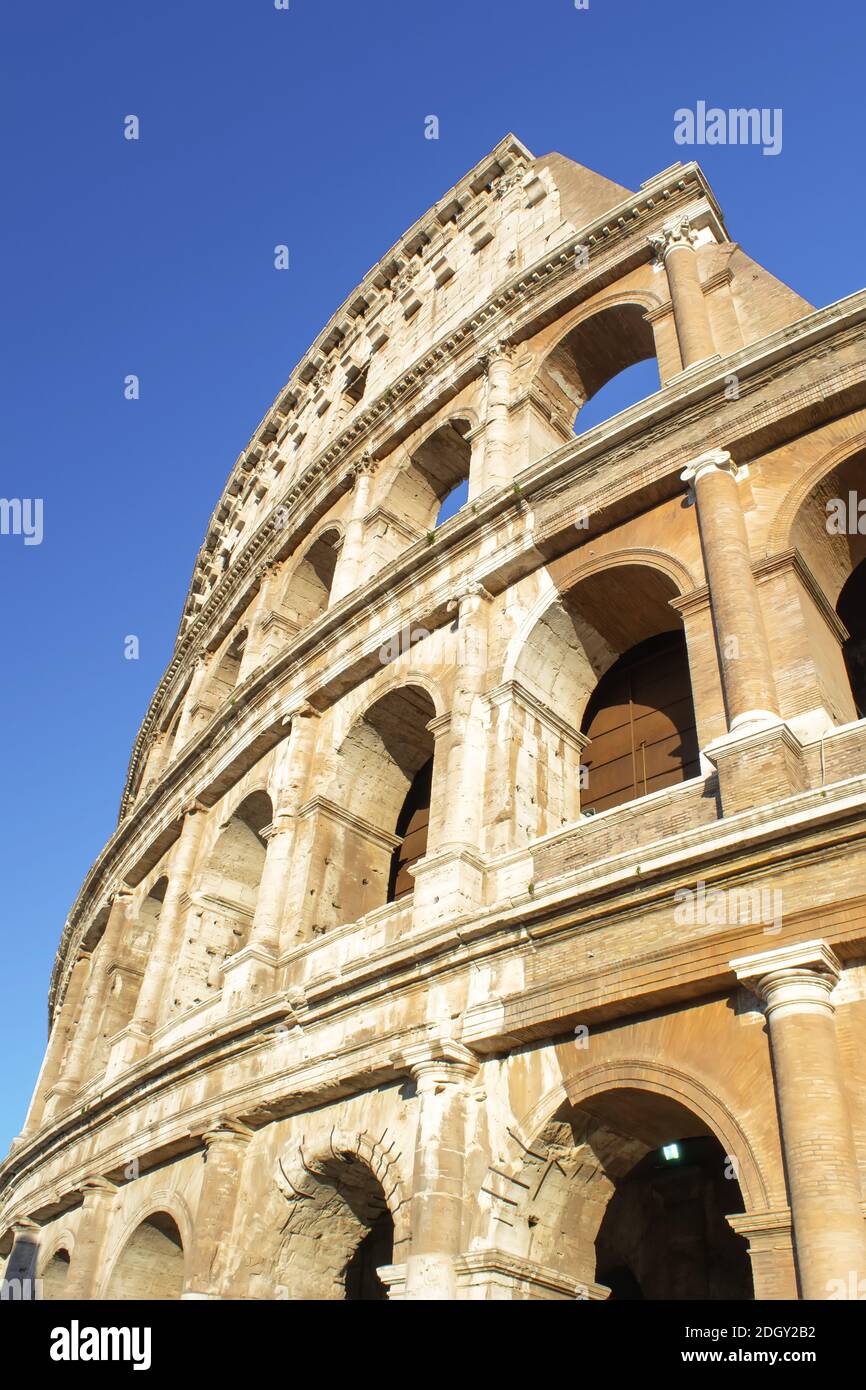 Part of Rome Colosseum at blue sky. Vertical image Stock Photo - Alamy