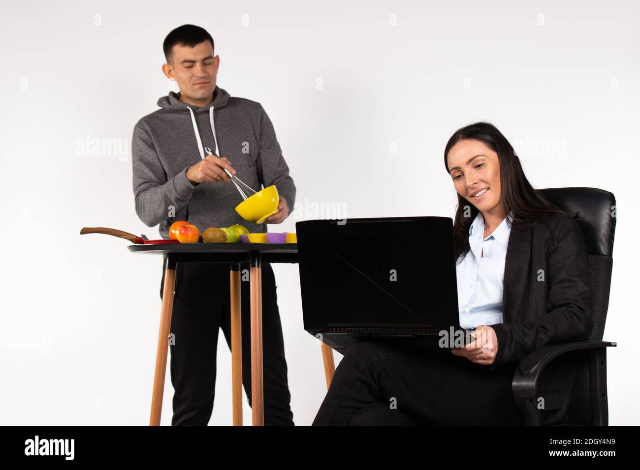Gender stereotypes. The man is cooking in the kitchen. The female ...