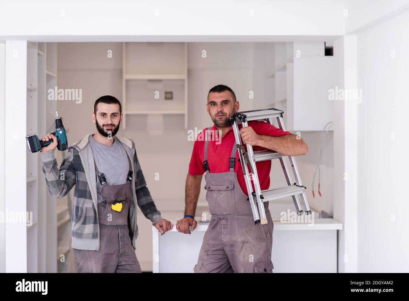Handyman workers install kitchen hi-res stock photography and images ...
