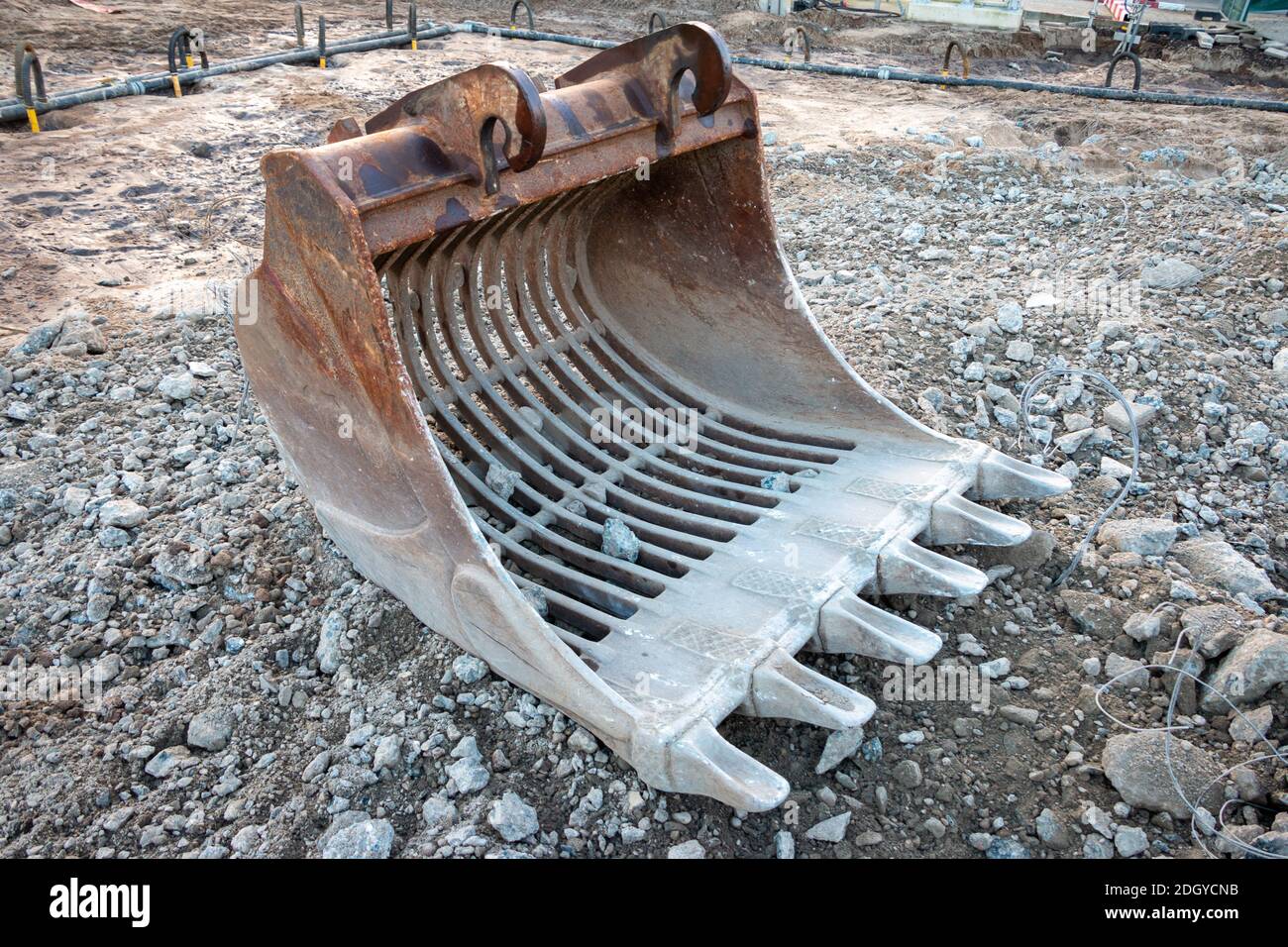 bucket of an excavator on a construction site in use for excavating an ...