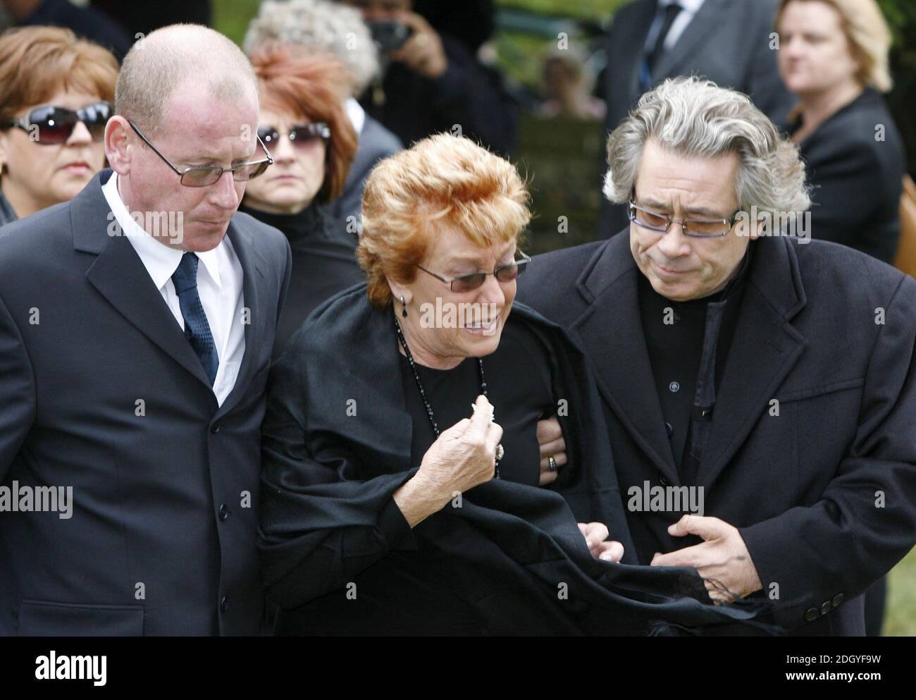 Mike Reid's widow Shirley (centre) arrives at the funeral of her late ...