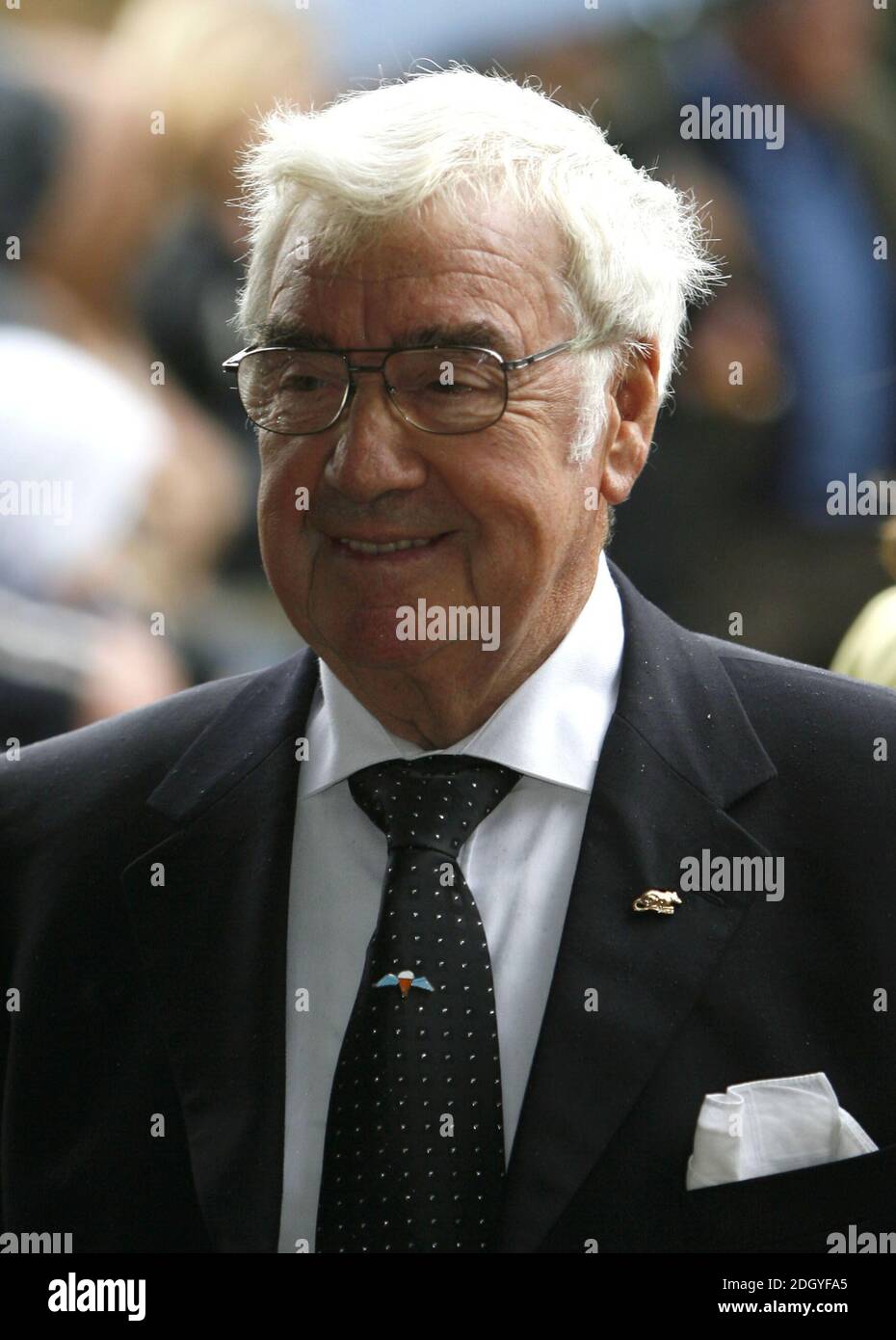 Frank Carson arriving at the funeral of Mike Reid, held at the Little ...