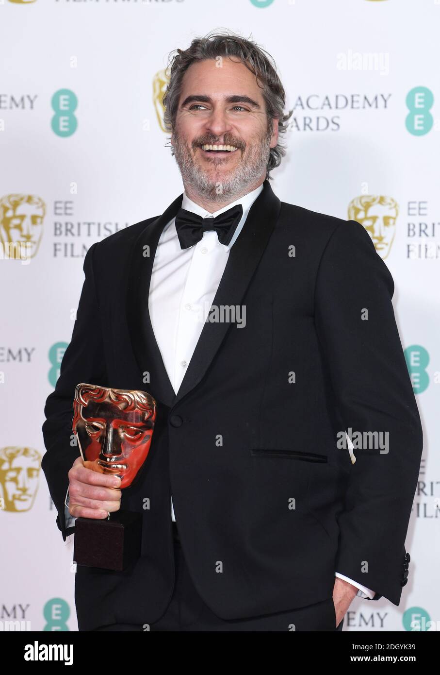 Joaquin Phoenix with his award for Best Actor at the 73rd British ...