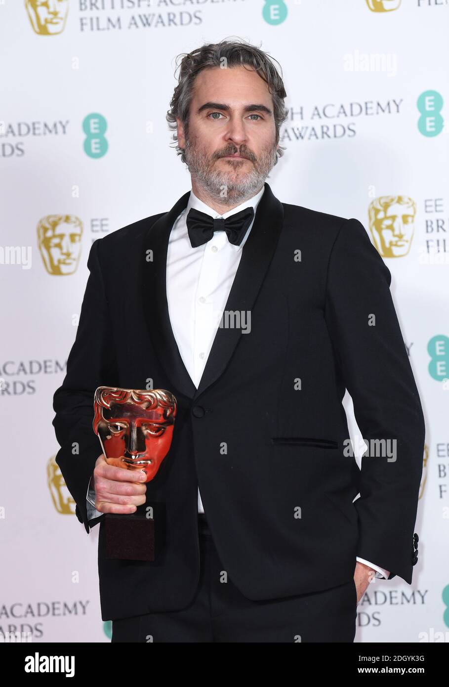 Joaquin Phoenix with his award for Best Actor at the 73rd British ...