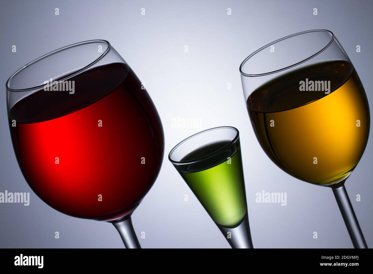 Three Colors of alcohol in glass Stock Photo - Alamy