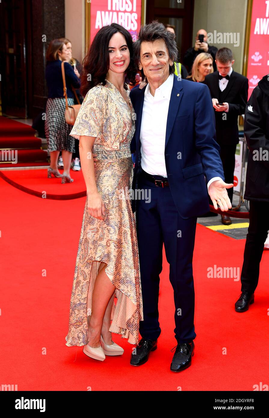 Ronnie Wood (right) and Sally Humphreys arriving at The Prince's Trust ...