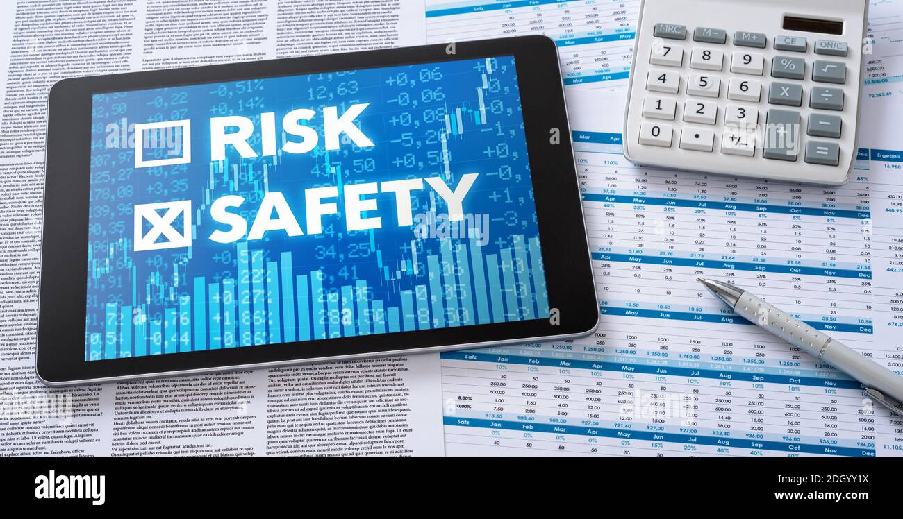 A tablet with financial documents - Risk or Safety Stock Photo - Alamy